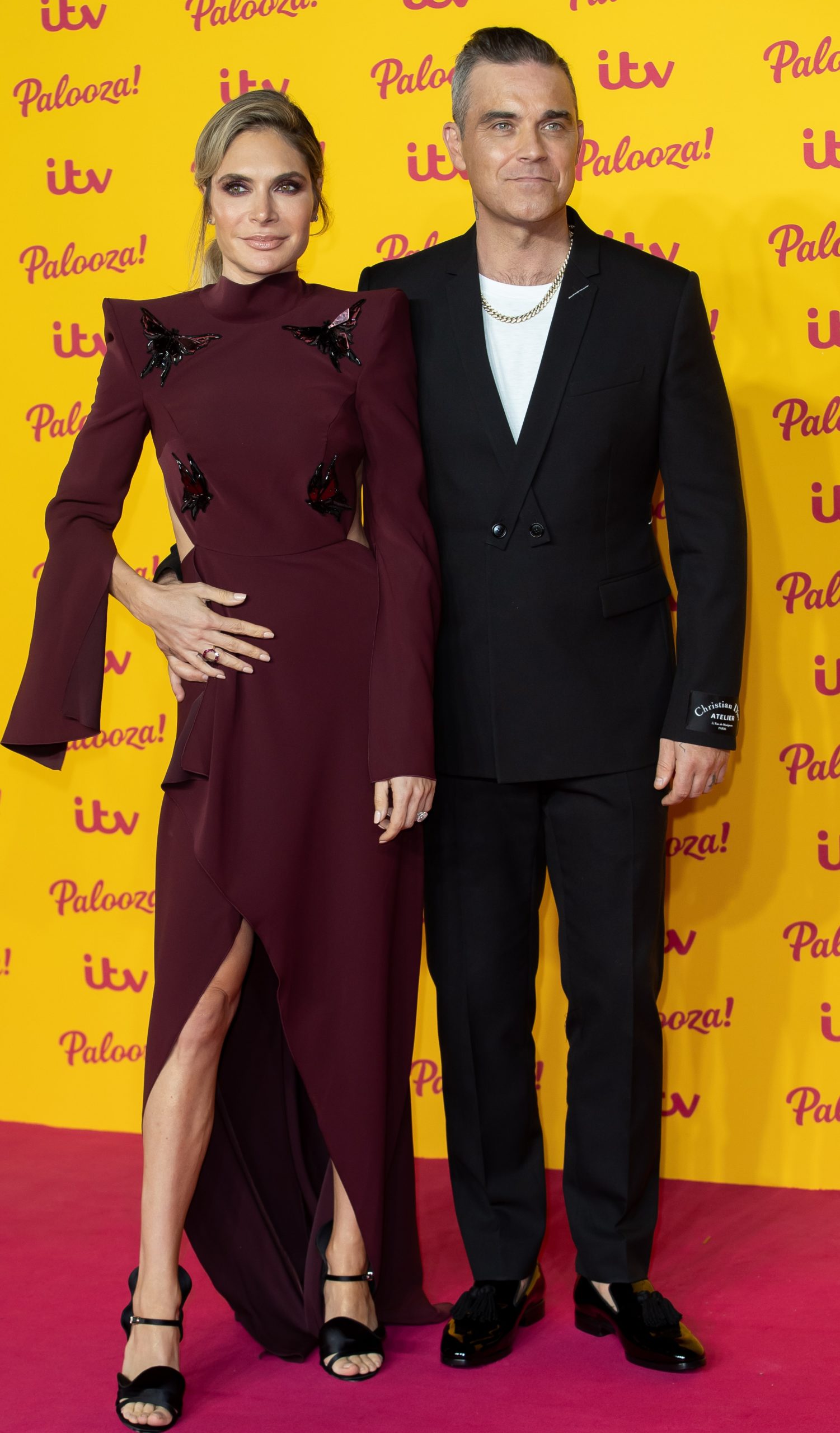 Robbie Williams shows off BALD head after wife Ayda Field shaves hair