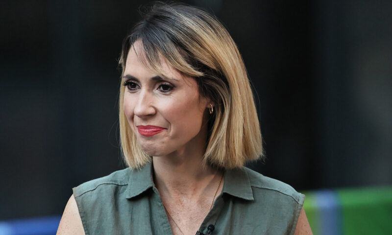 Alex Jones poses with baby daughter as she works the 'night shift'