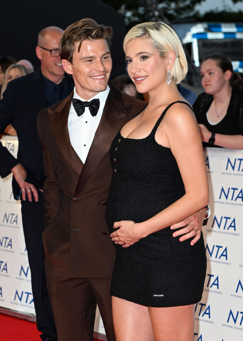 Pregnant star Pixie Lott shows off baby bump in ripped red dress